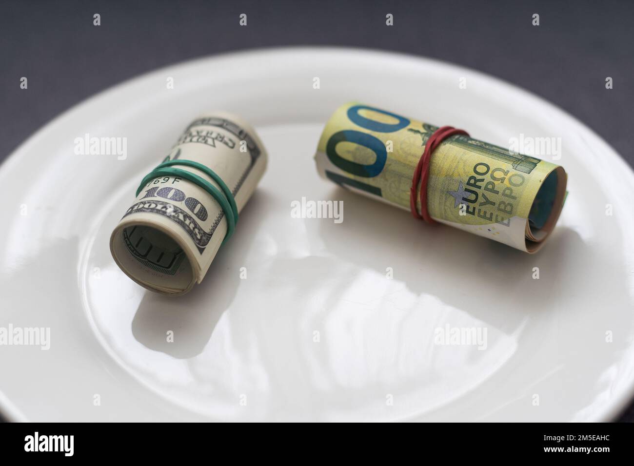 Cash in plate hundred dollar bills on white background, Money meal ...