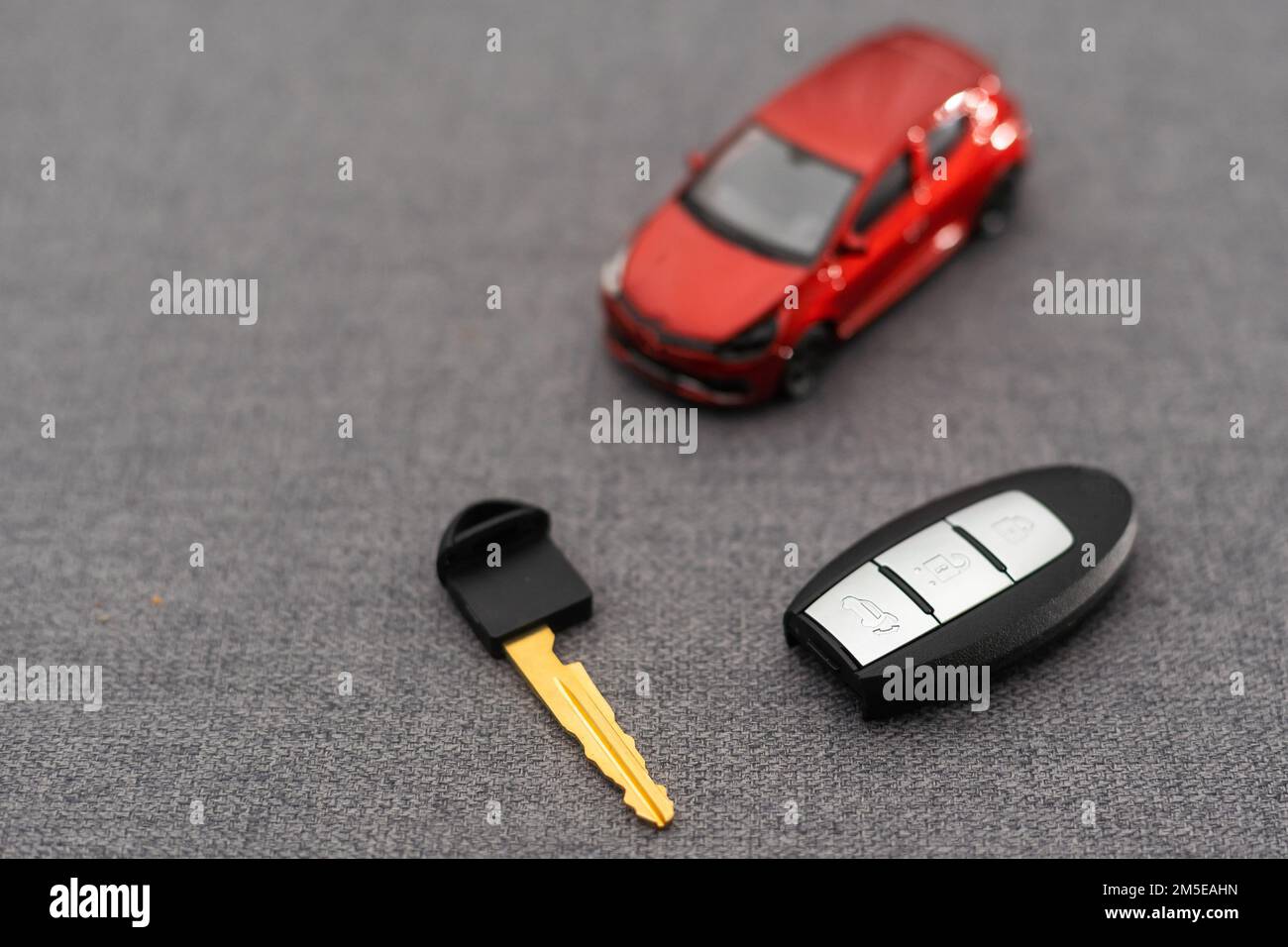 Car key and toy car. Automobile security accessories Stock Photo - Alamy