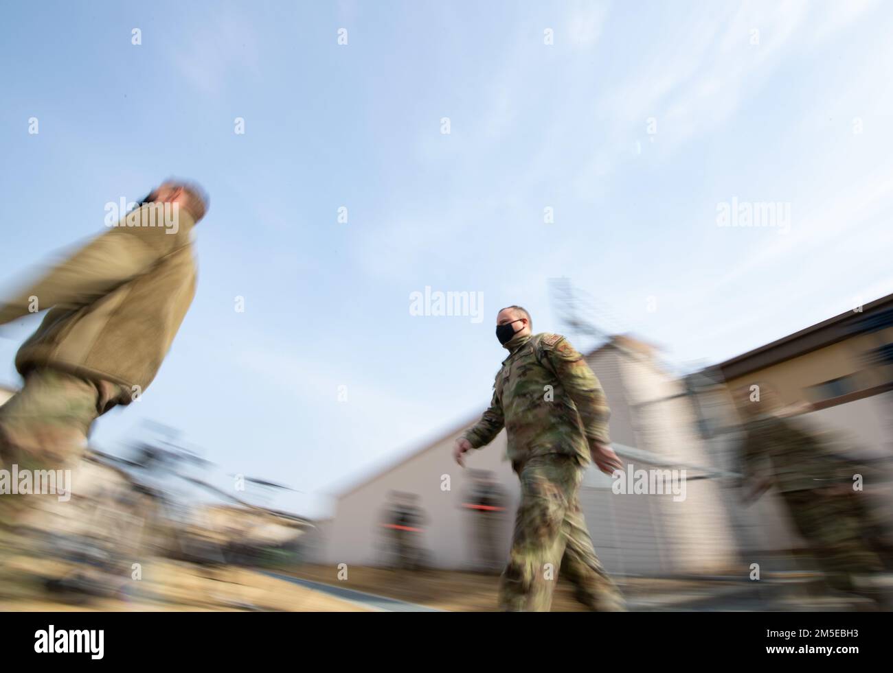 Airmen assigned to the 8th Communications Squadron are escorted to a ...