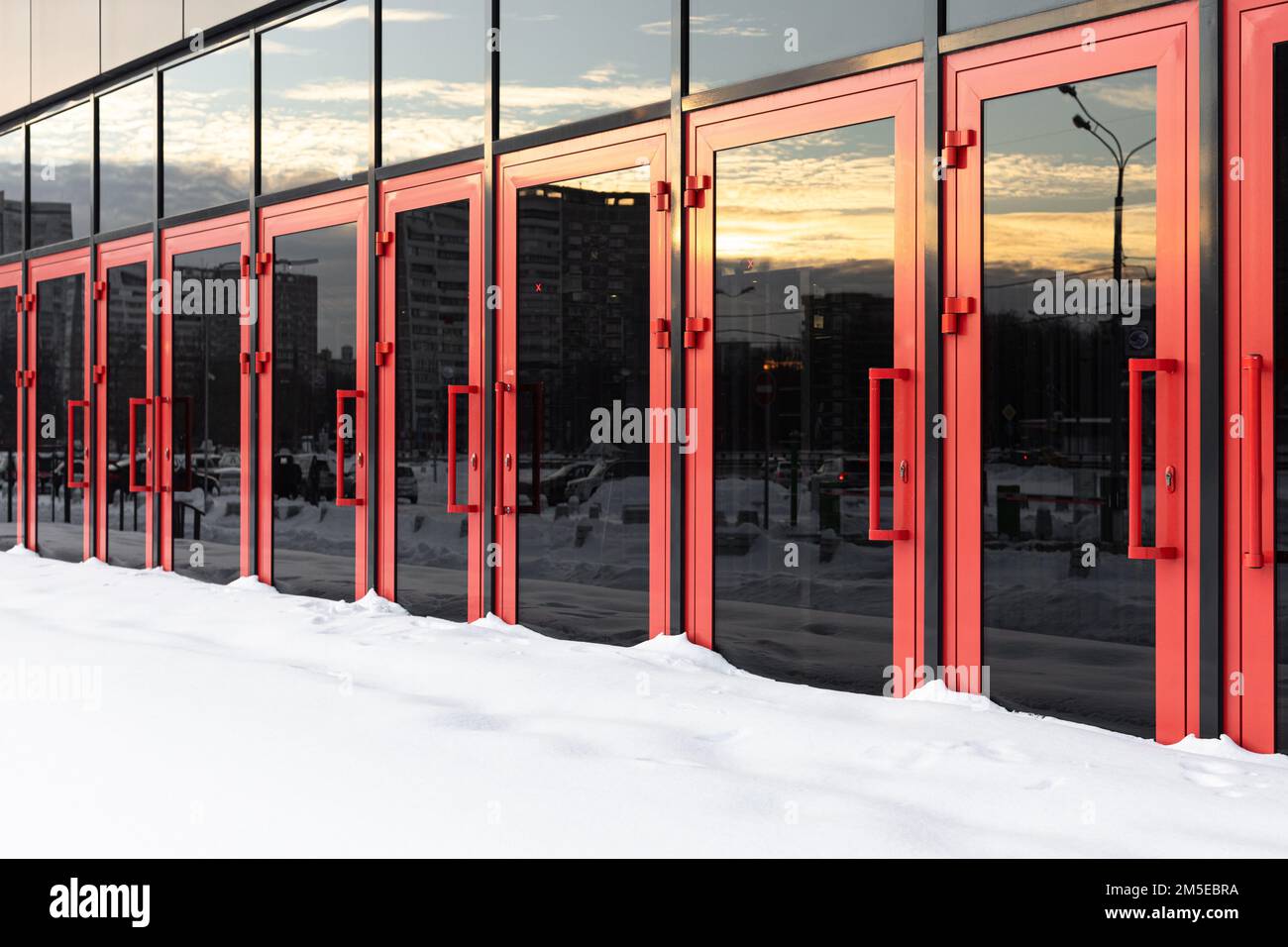 glass door covered with snow in winter. snow covered door. consequences ...