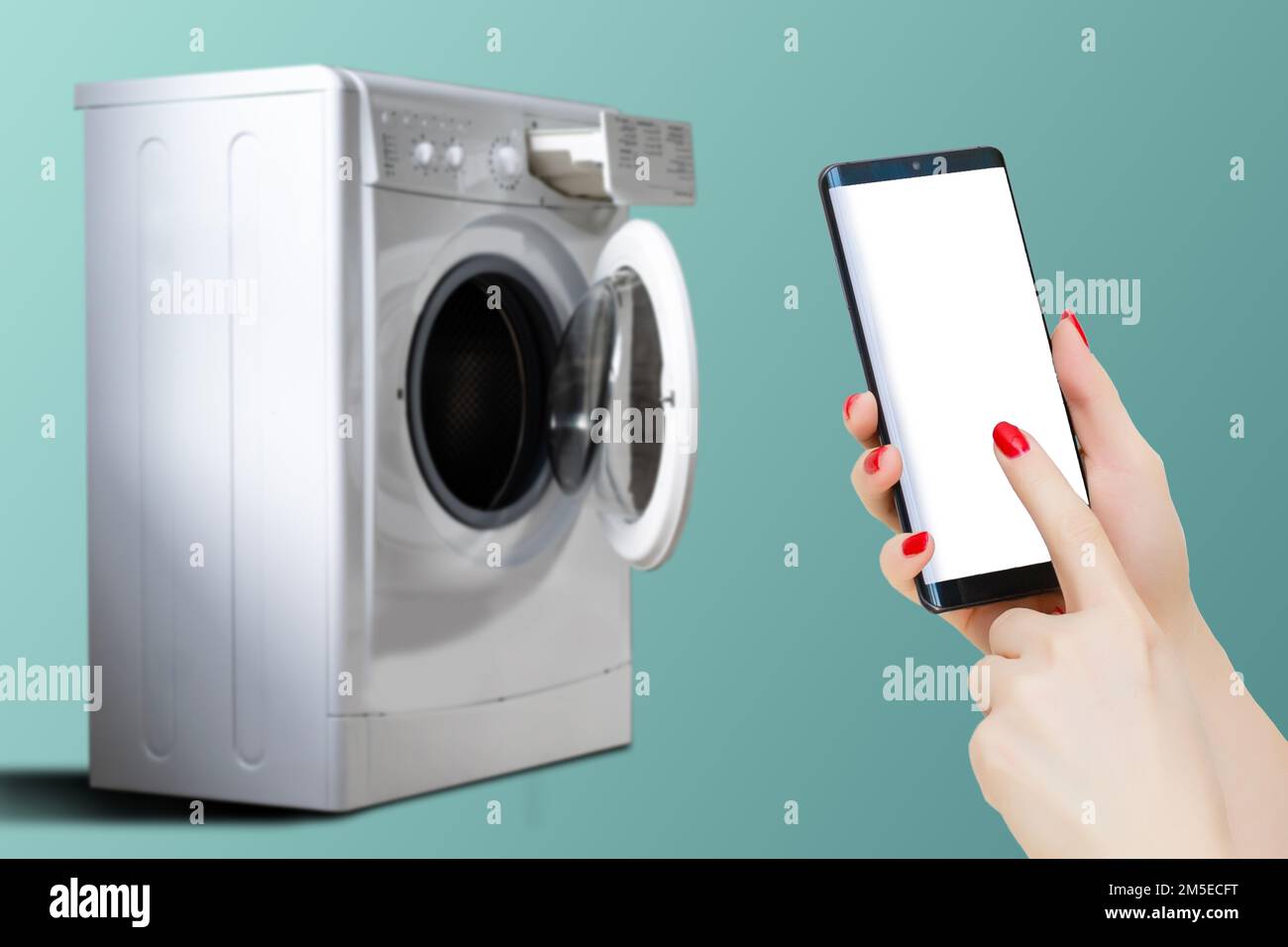 Close-up Of Woman Hand Using Mobile Phone App To Operate Smart Washing ...