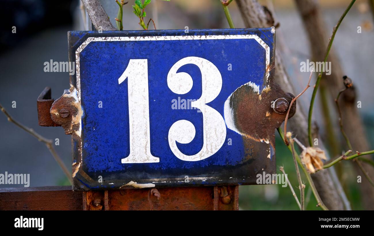 A closeup of sign number thirteen in blue and white outdoors Stock ...