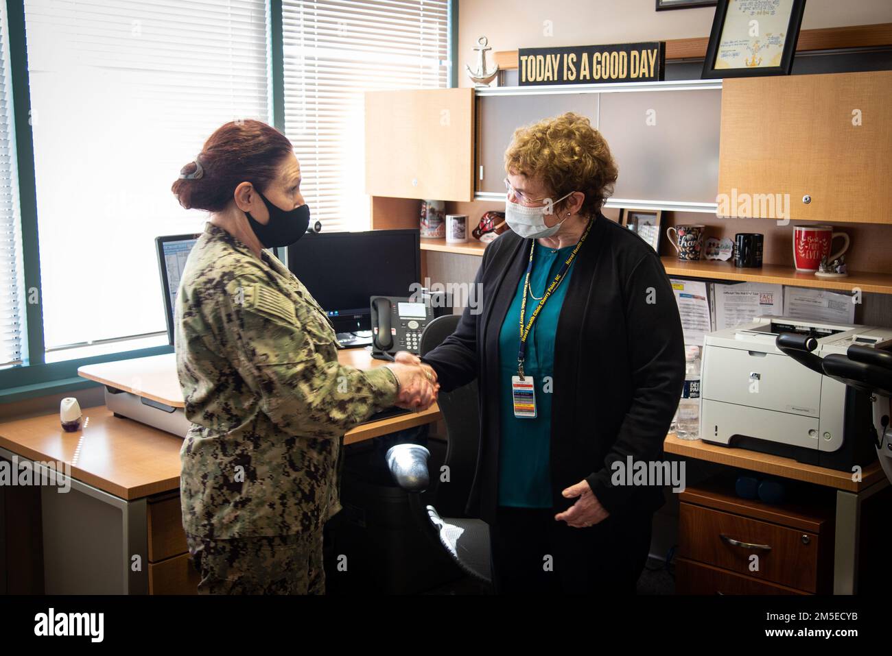 Dr. Patricia Lillquist, right, receives a Commander’s Coin in ...