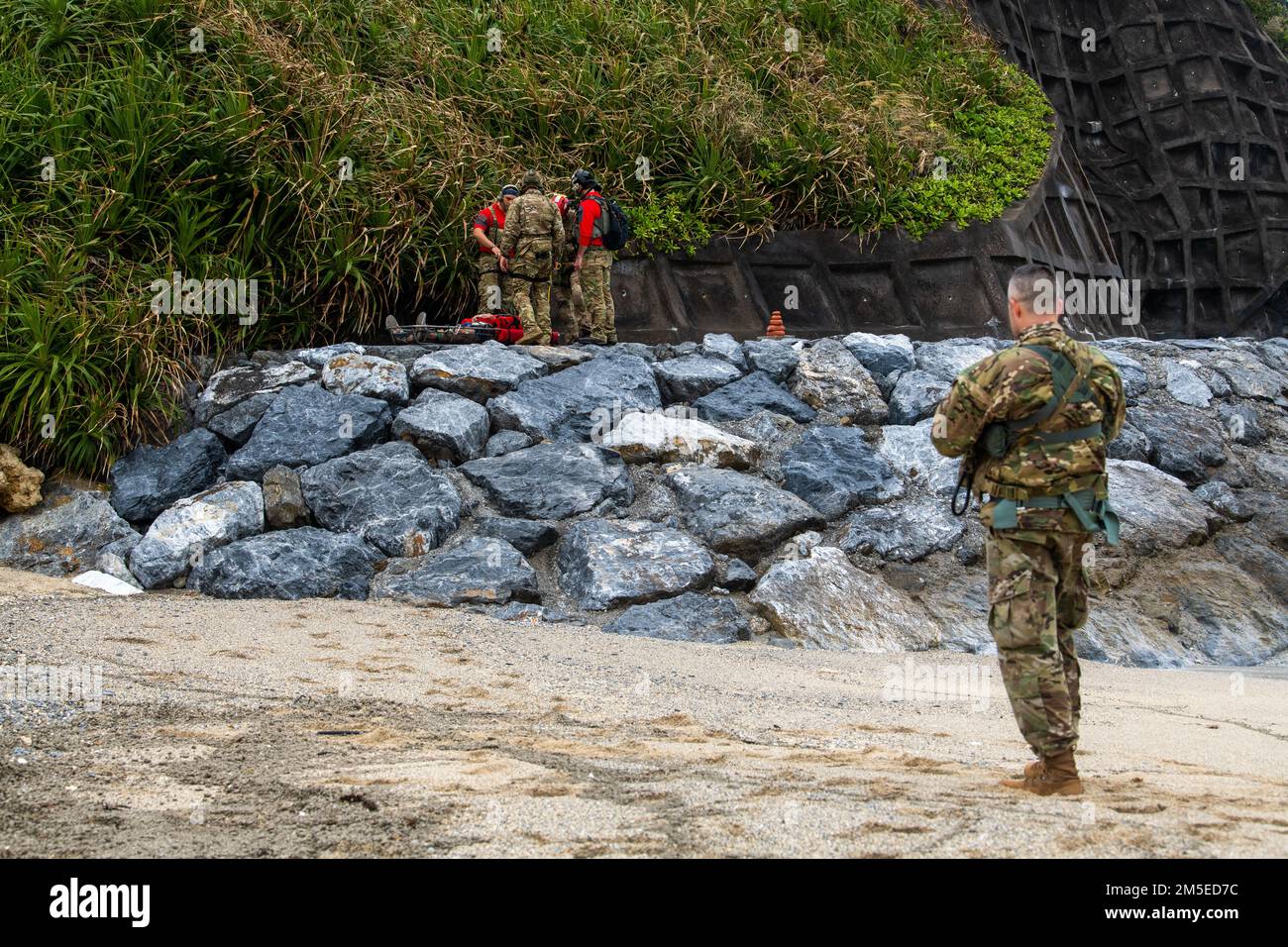 U.S. Air Force Pararescuemen begin transfer of an injured victim during ...