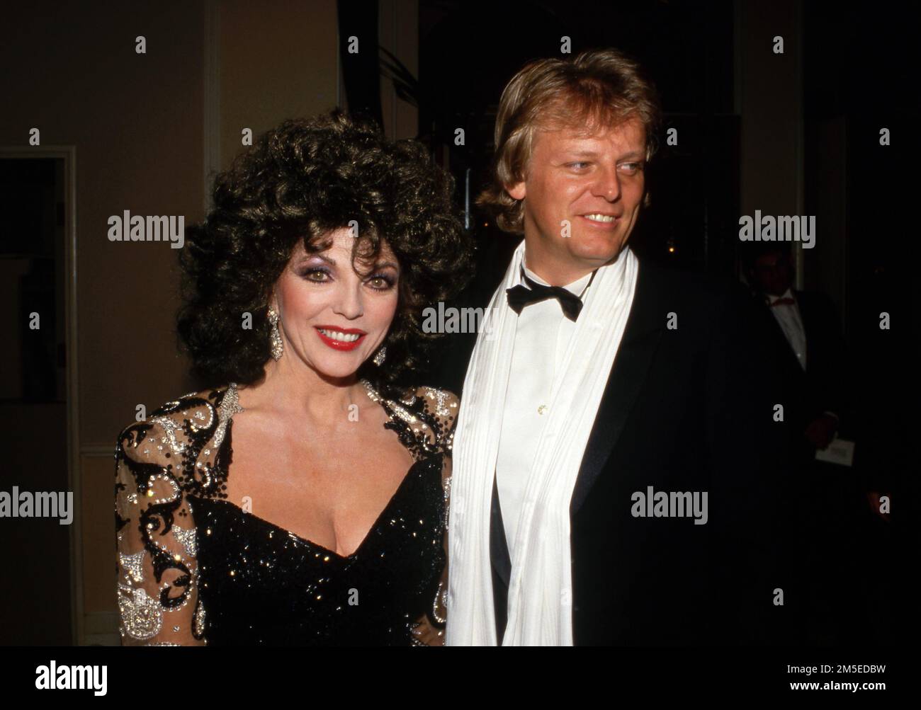 Joan Collins and Peter Holm at the 43rd Annual Golden Globe Awards in ...