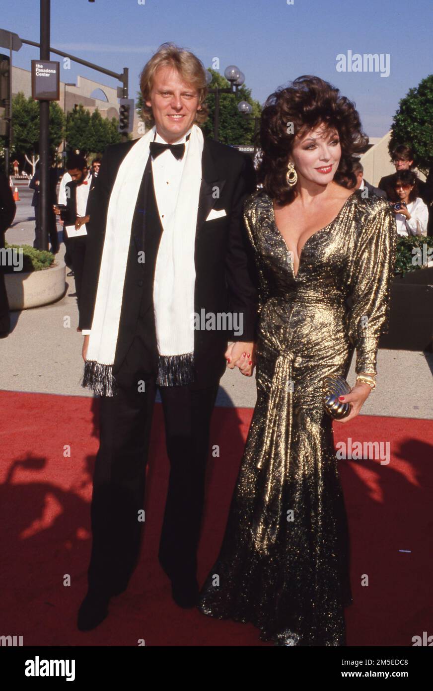 Joan Collins and Peter Holm at the 38th Annual Primetime Emmy Awards ...