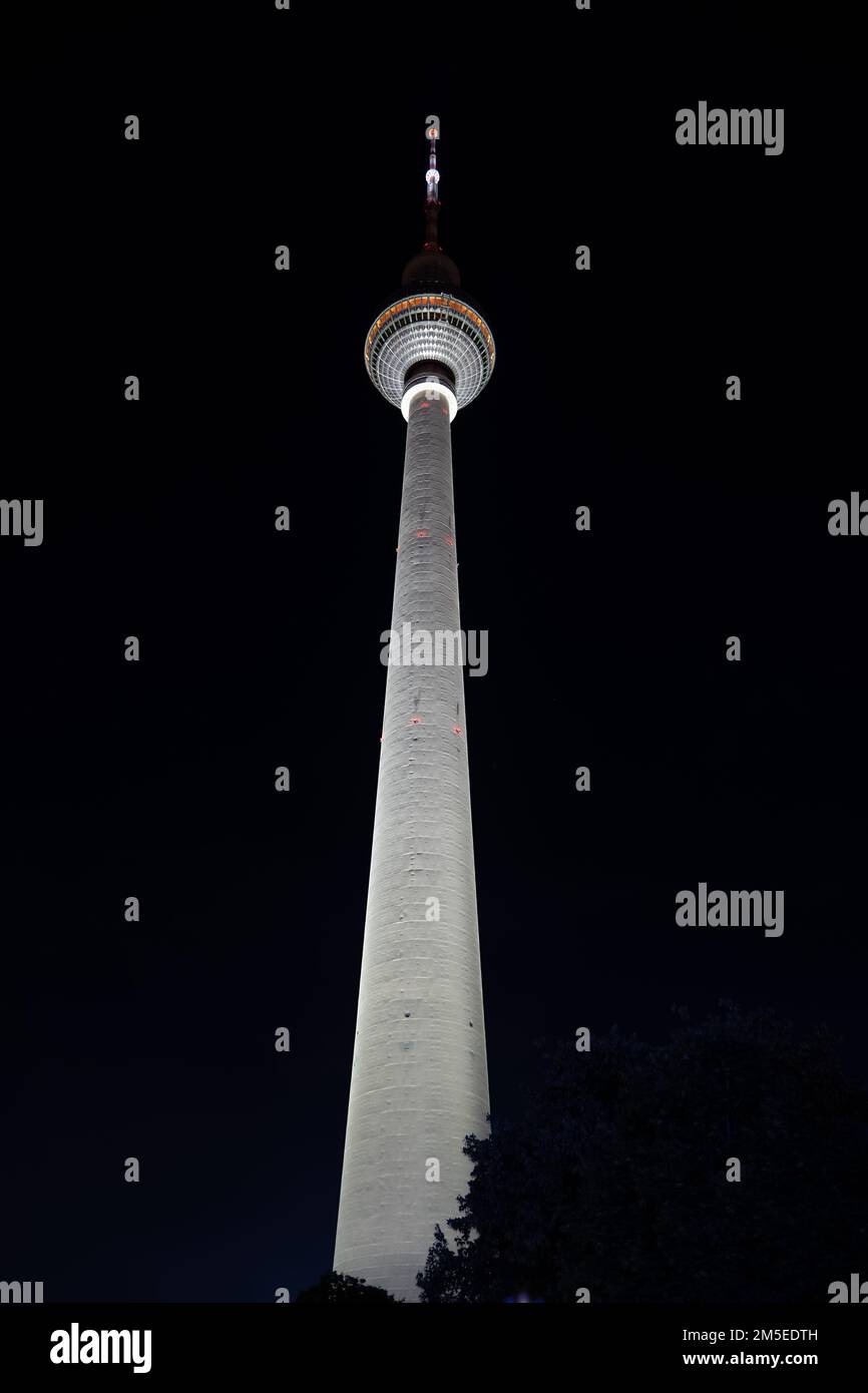 Television Tower (Fernsehturm) illuminated at night in city of Berlin ...