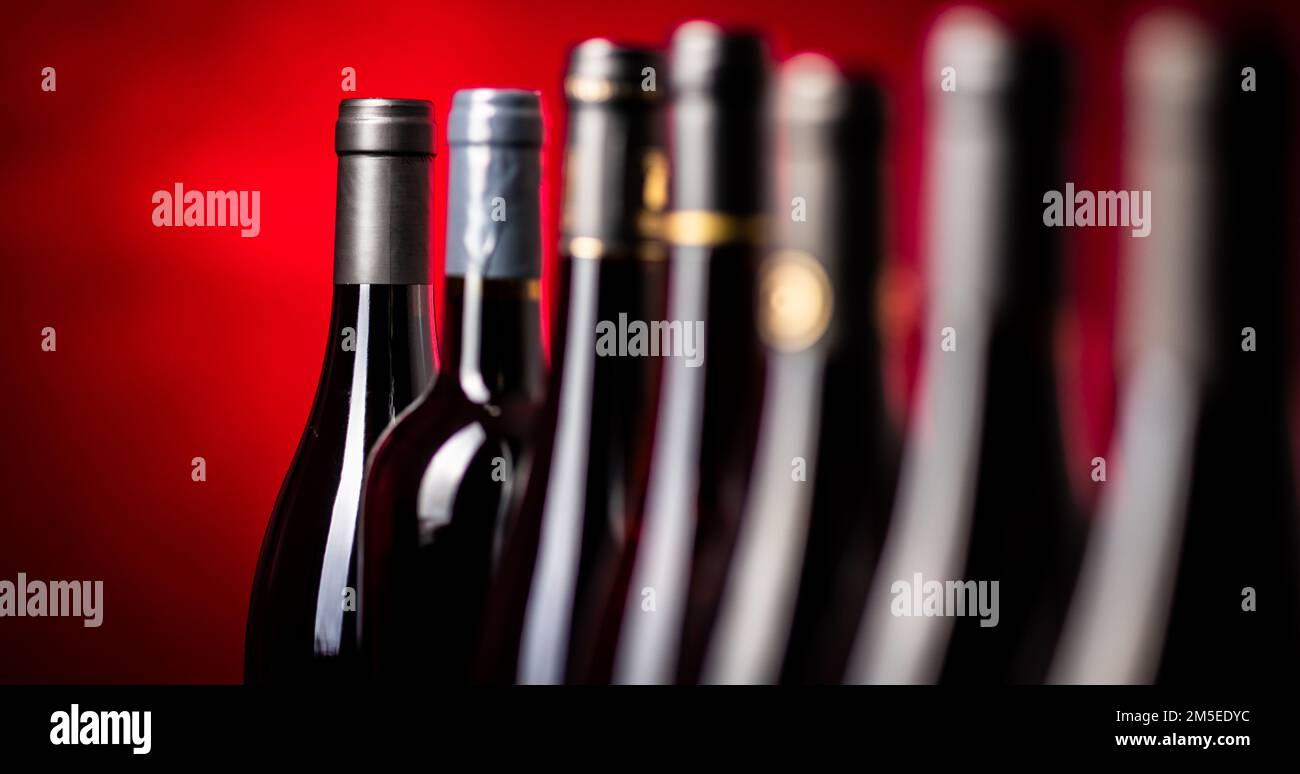 Bottles of quality red wines shot with shallow DOF; color toned image ...