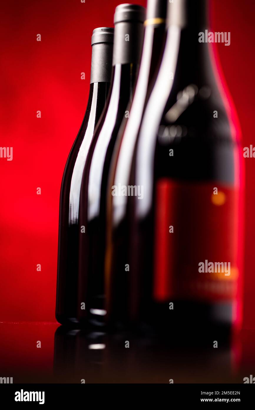 Bottles of quality red wines shot with shallow DOF; color toned image ...