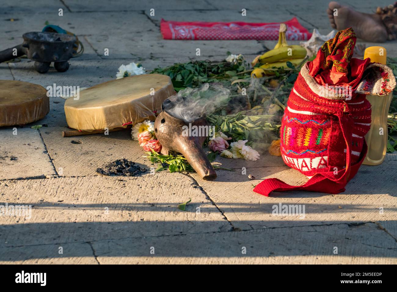 Copal incense burning before an offering in a plaza in Oaxaca, Mexico during the Guelaguetza ...