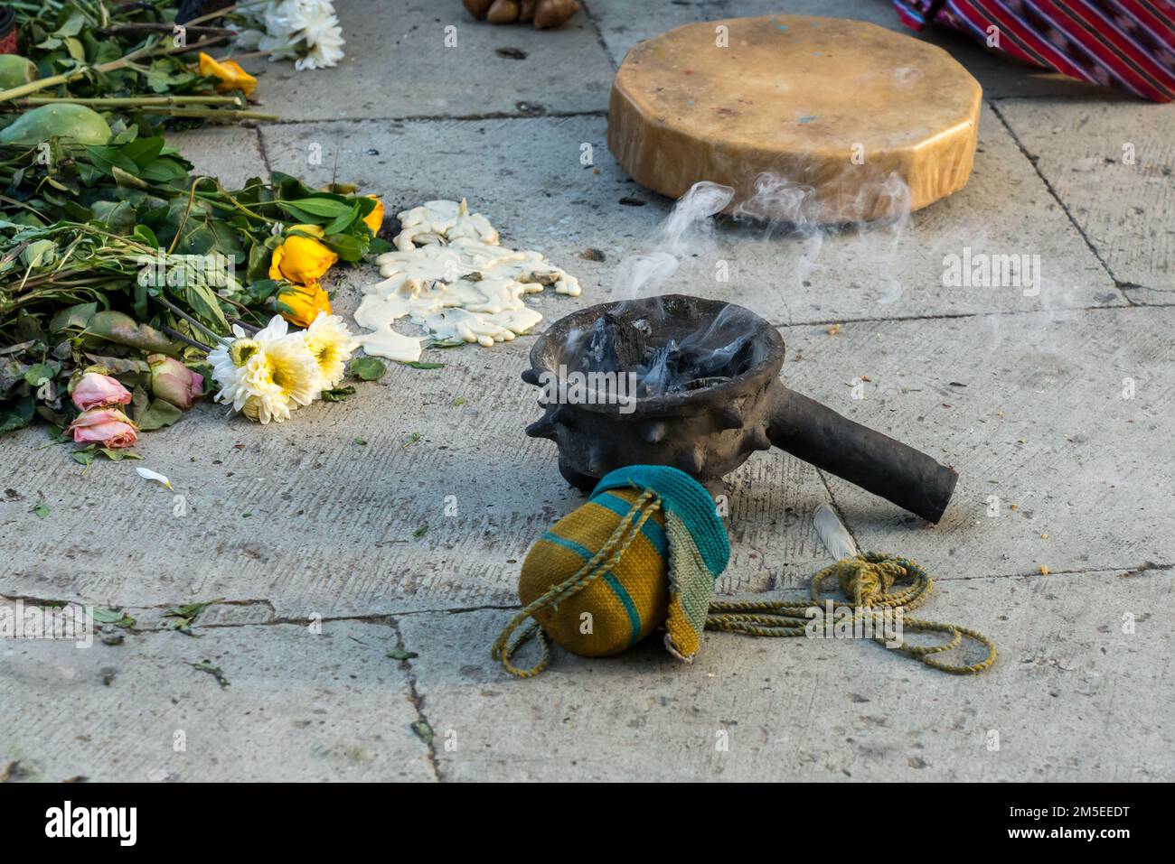 Copal incense burning before an offering in a plaza in Oaxaca, Mexico during the Guelaguetza ...