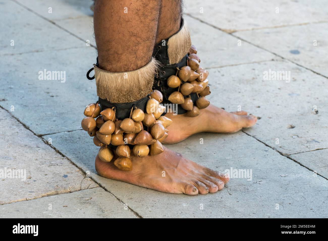 Ayoyote nut rattles on the ankles of a Zapotec dancer in a square in ...
