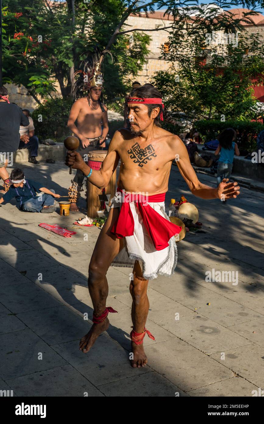 A tattooed Zapotec dancer in a loincloth dances in a plaza in Oaxaca ...