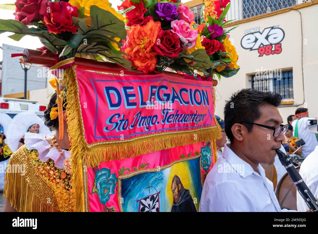 A musician and banner for the dance troupe from Santo Domingo ...