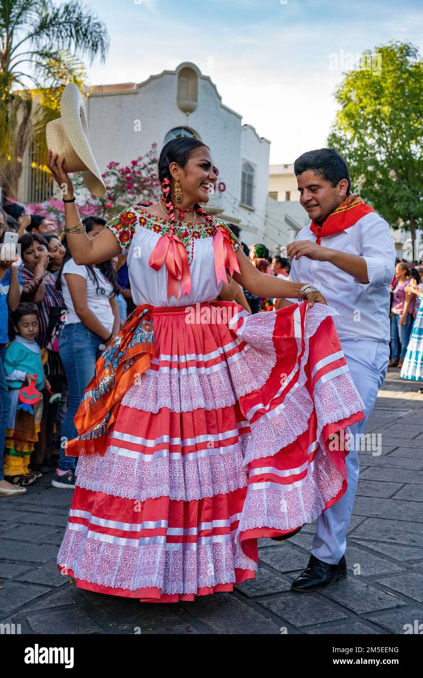 A young attractive couple in traditional dress from Santiago Pinotepa ...