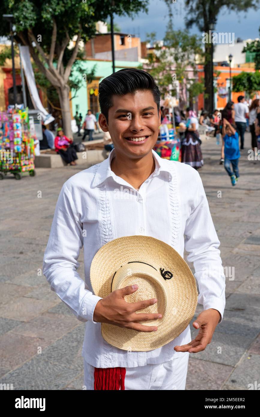 A portrait of a young farolero dancer from the Chinas Oaxaquenas dance ...