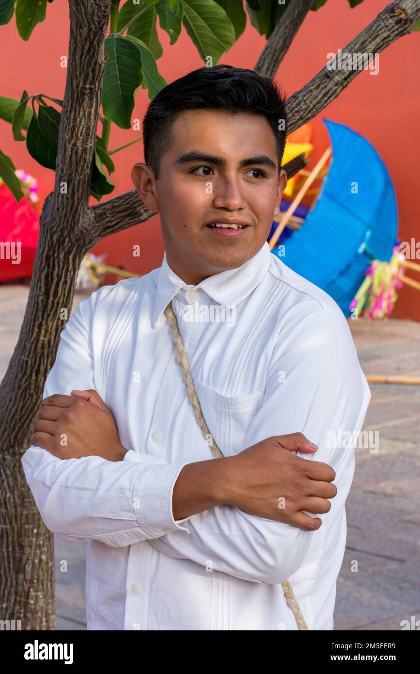 A portrait of a young farolero dancer from the Chinas Oaxaquenas dance ...