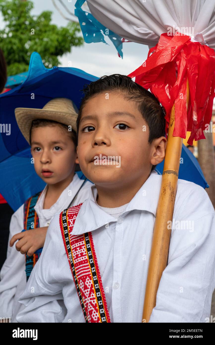 A portrait of a young farolero dancer from the Chinas Oaxaquenas dance ...