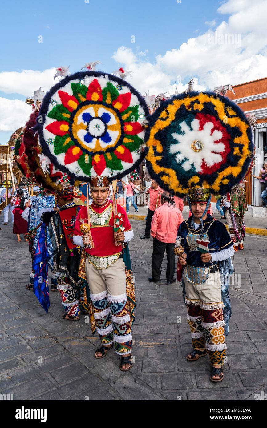 Aztec warriors from the Danza de la Pluma dance troupe from Teotitlan de Valle at a Guelaguetza ...