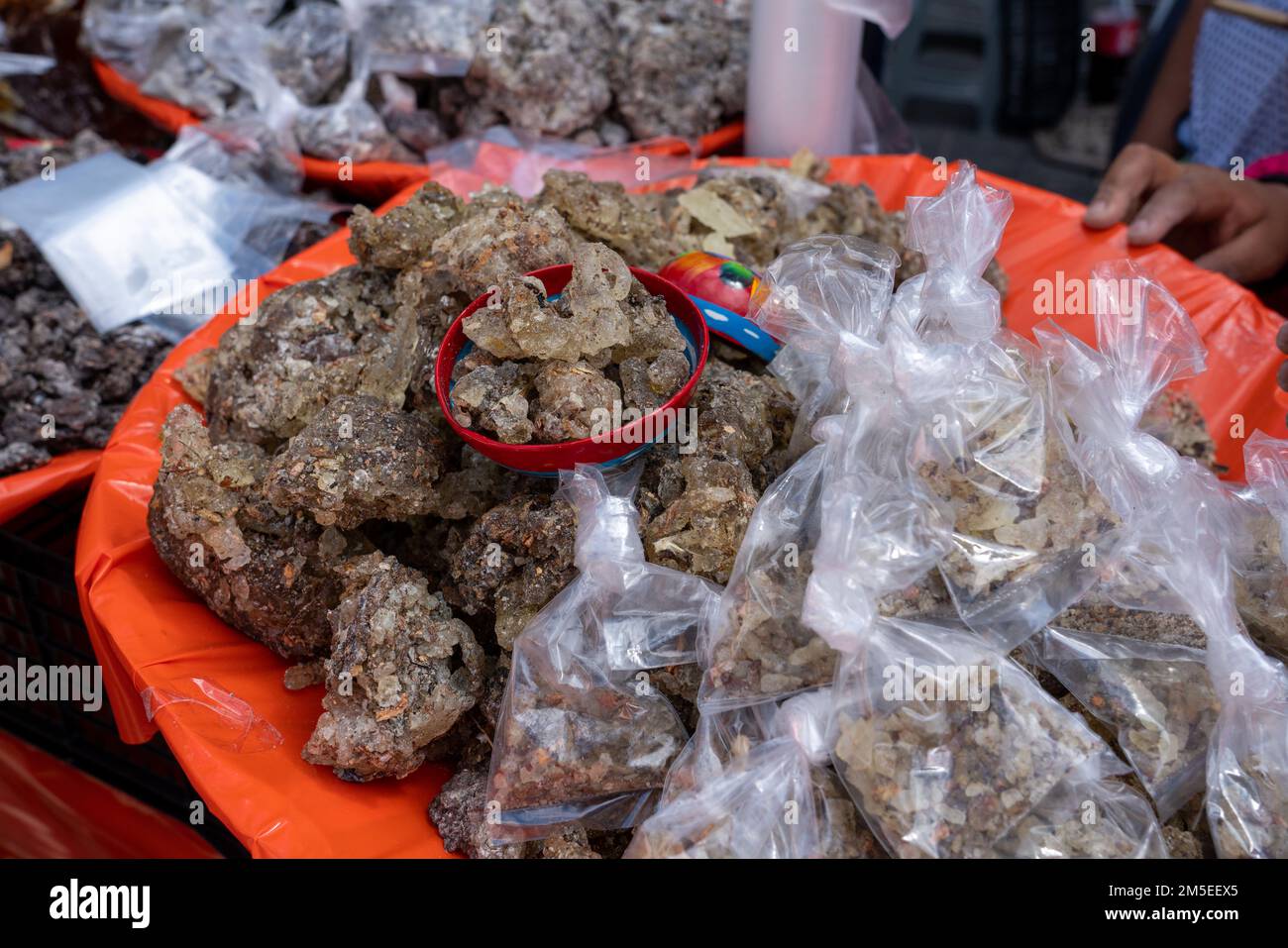 Copal resin incense for sale in a street market for celebrating the Dead or Dia de los Muertos ...