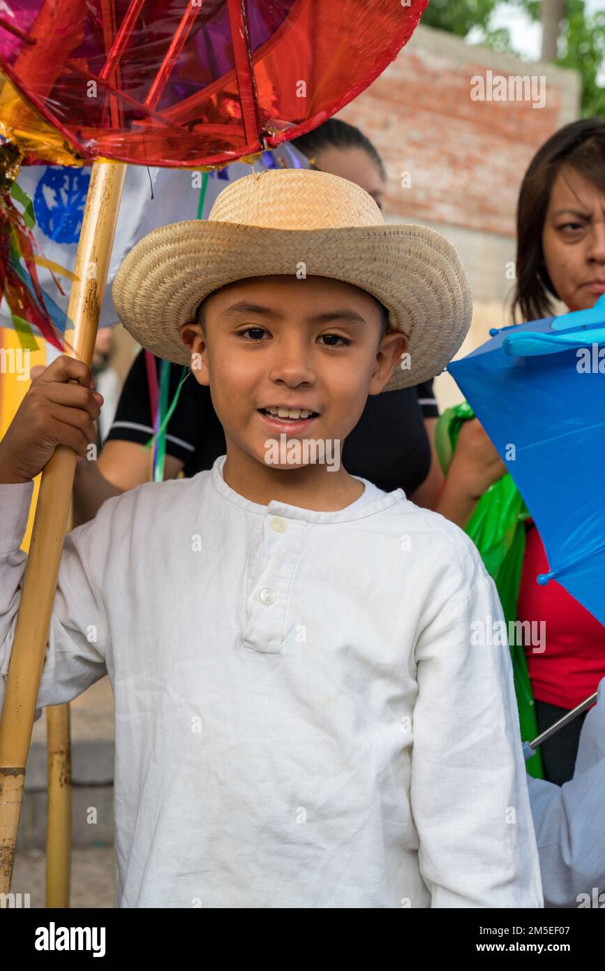 A portrait of a young farolero dancer from the Chinas Oaxaquenas dance ...