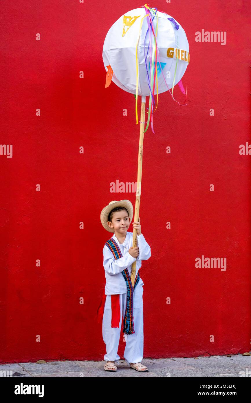 A portrait of a young farolero dancer from the Chinas Oaxaquenas dance ...