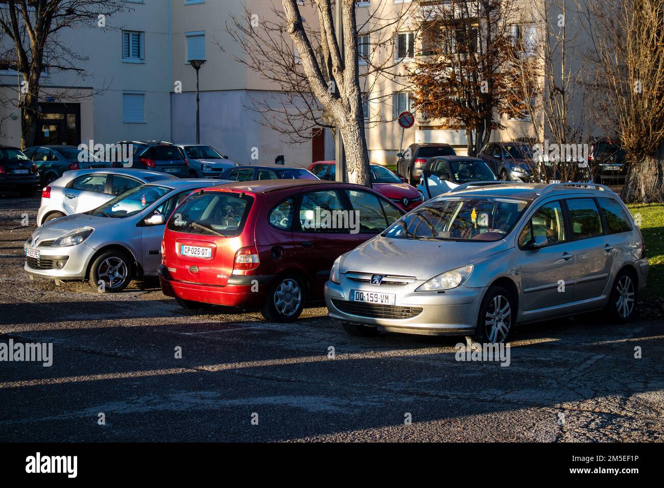 Reims, France - December 27, 2022 Various cars parked in the downtown ...