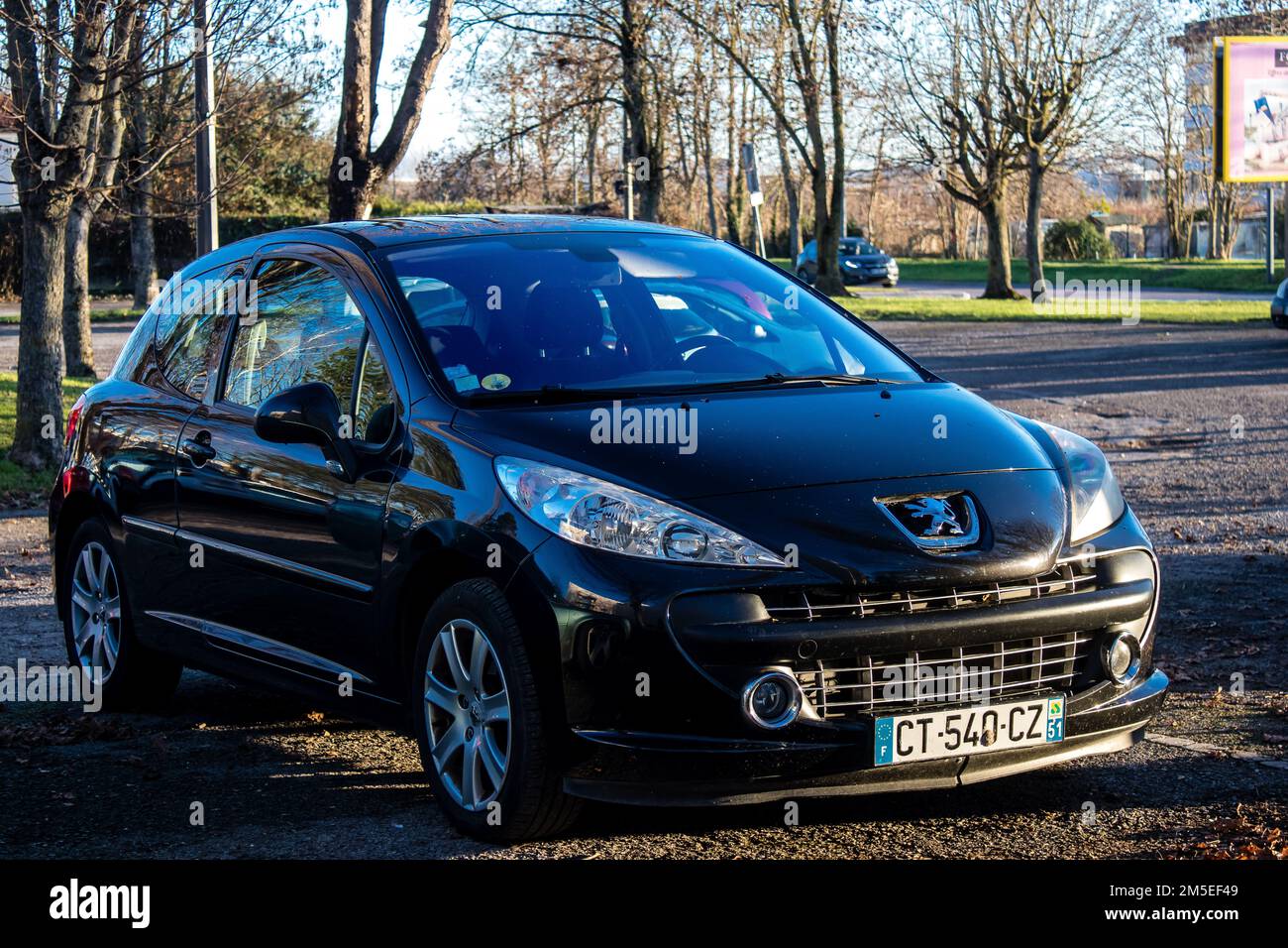Reims, France - December 27, 2022 Various cars parked in the downtown ...