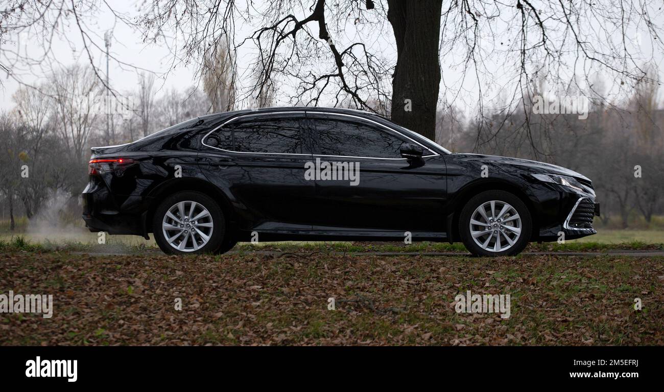 Modern car moving at the country side background Stock Photo - Alamy