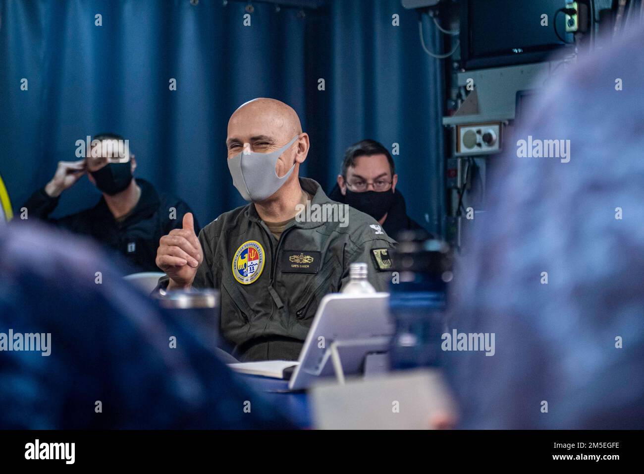 PACIFIC OCEAN (Mar. 7, 2022) Capt. Greg Baker, commodore of Amphibious Squadron Eleven, conducts ...