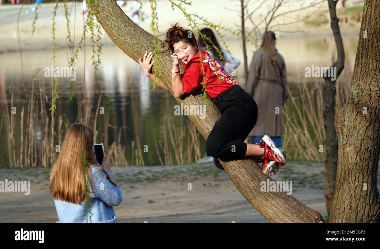 Kiev, Ukraine March 29, 2020: People walk and relax in the spring park ...