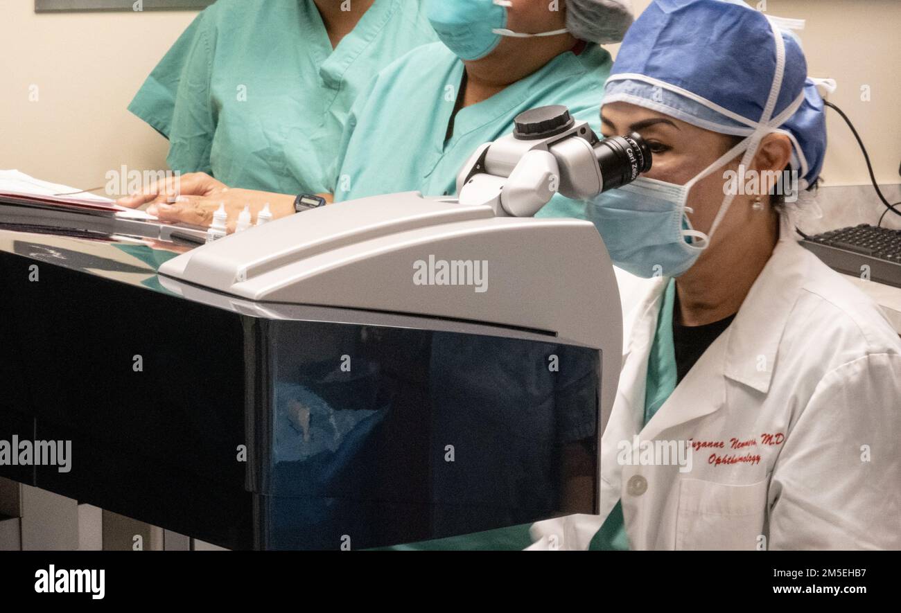 Dr. Suzi Nemmers looks thru Ophthalmology equipment during recent PRK ...