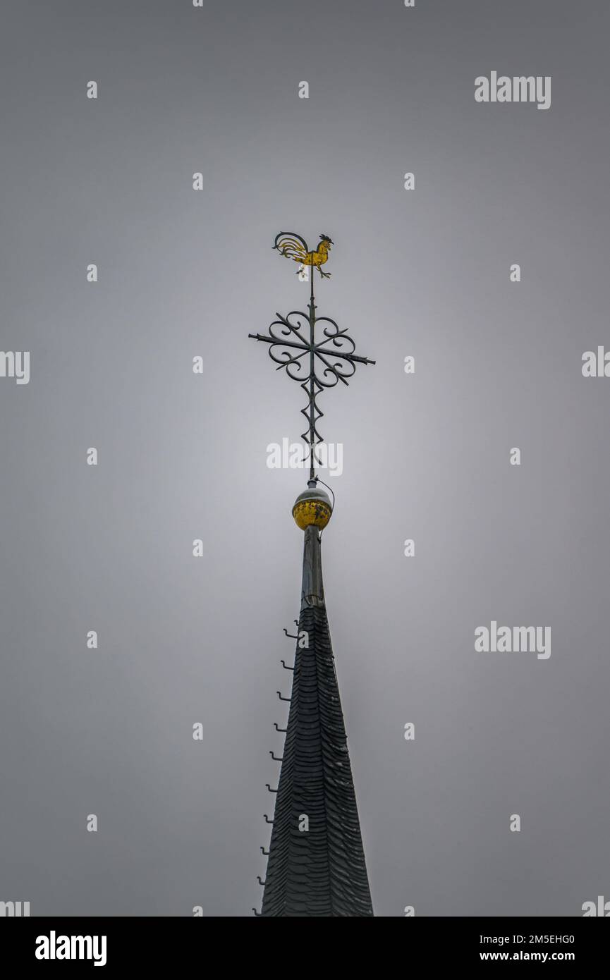 Church tower with golden sphere and rooster on top of slate roof Stock ...