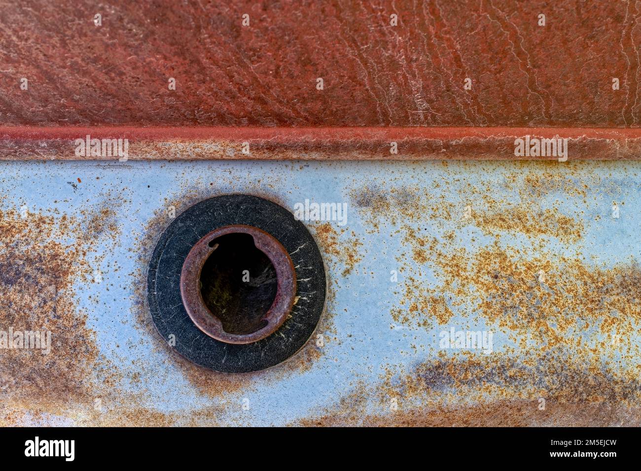 The uncapped gas tank opening of a rusty antique car Stock Photo - Alamy