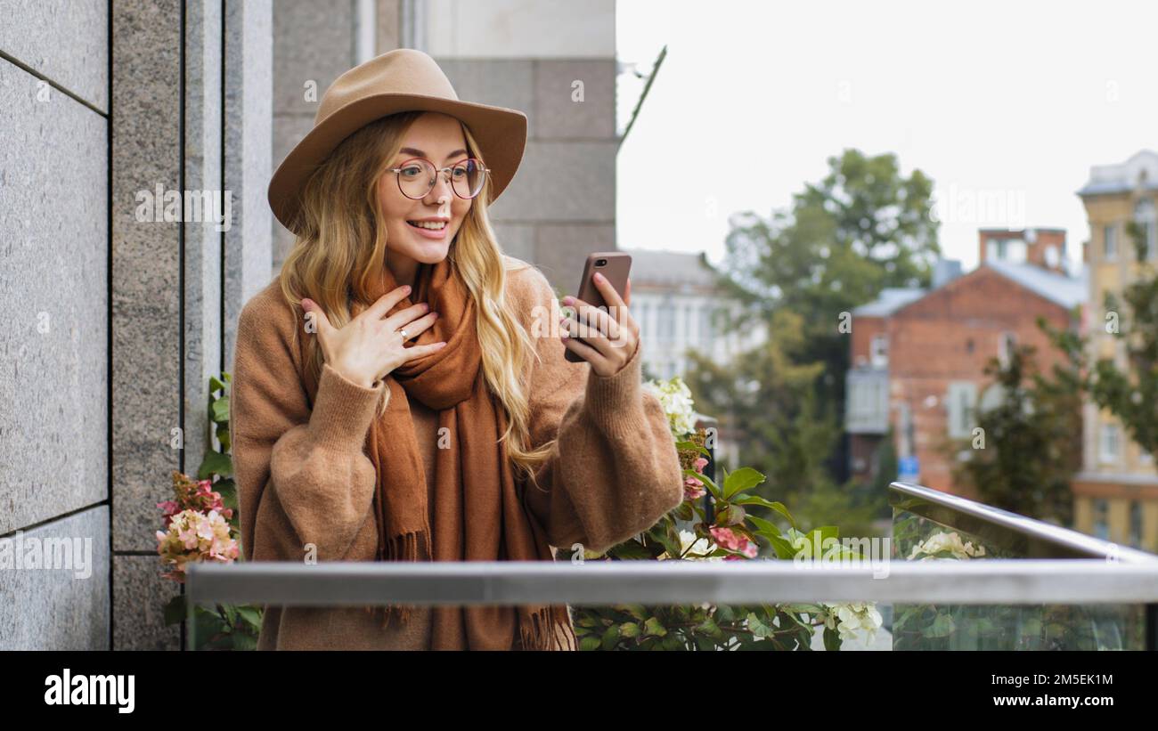 Shocked amazed wonder surprised Caucasian woman female lady looking at ...