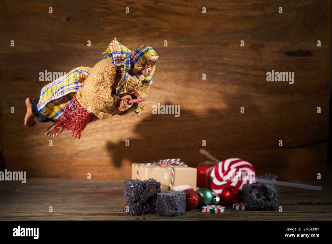 The Befana with sweet coal and candy. Italian Epiphany day tradition ...