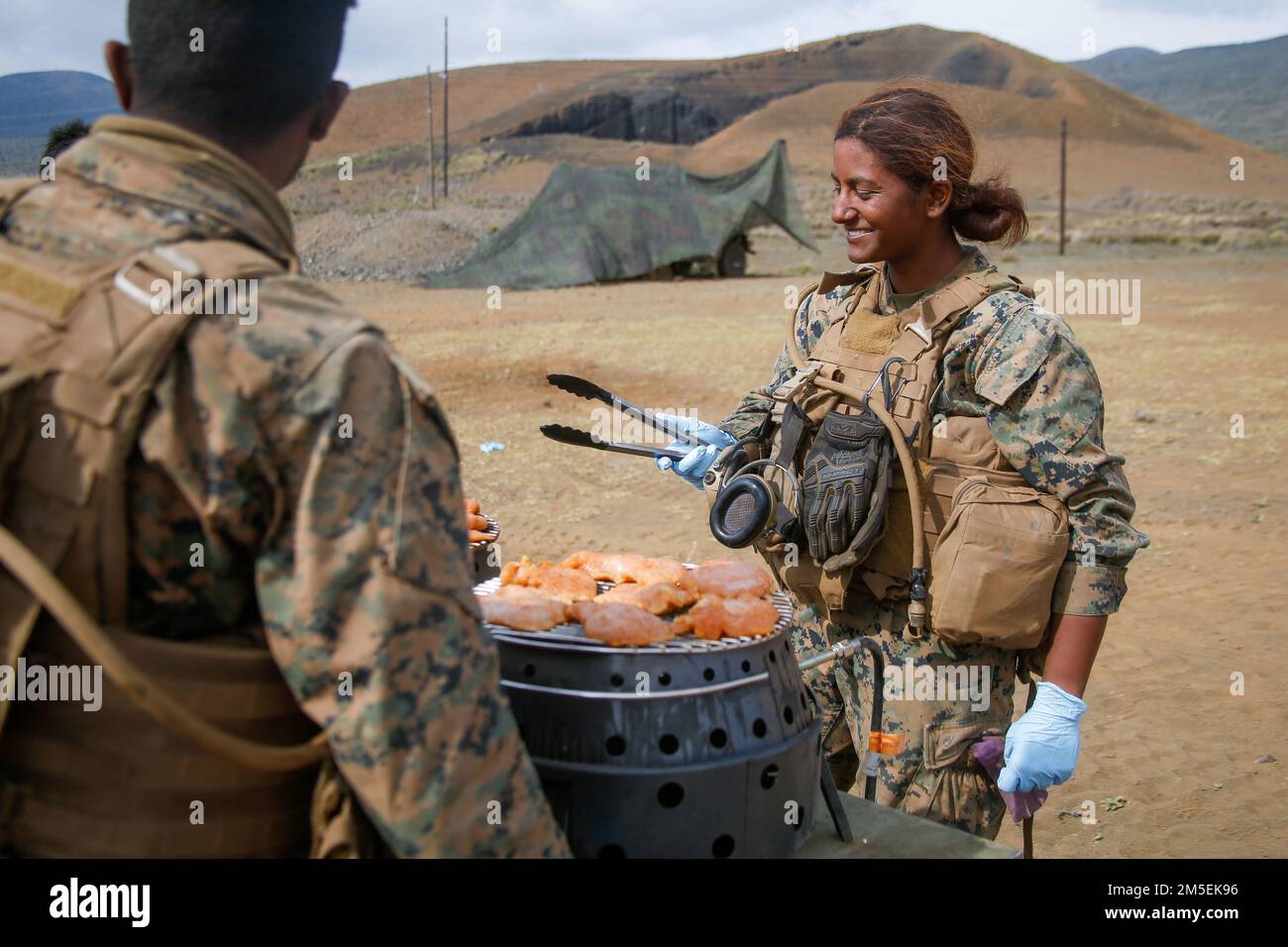 A U.S. Marine with 1st Battalion, 12th Marines, 3d Marine Division uses ...