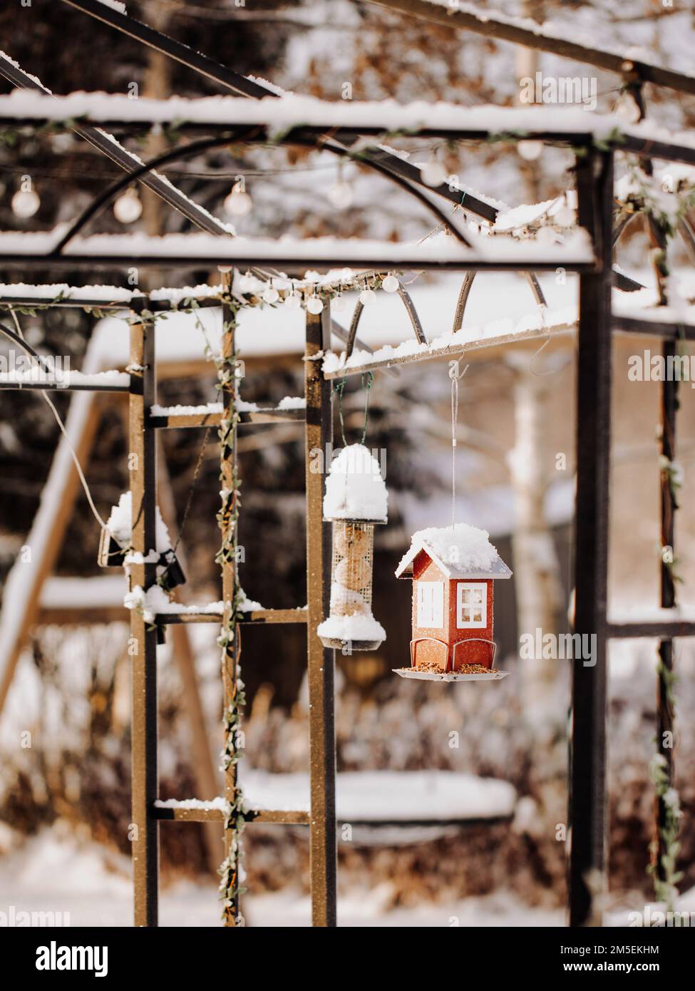 Swedish red bird feeders in the winter. swedish red houses Stock Photo ...