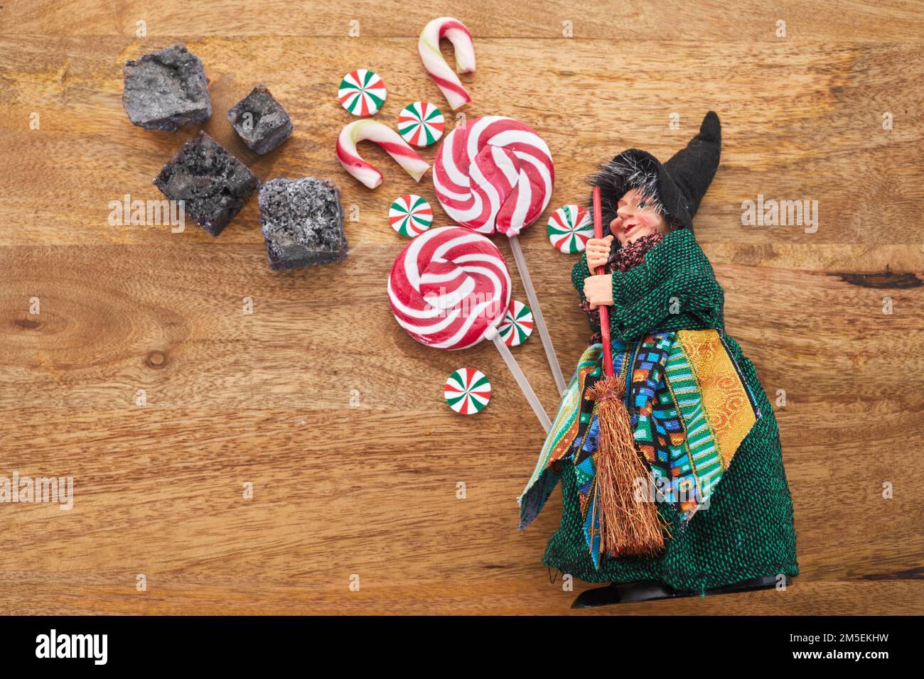 The Befana with sweet coal and candy. Italian Epiphany day tradition ...