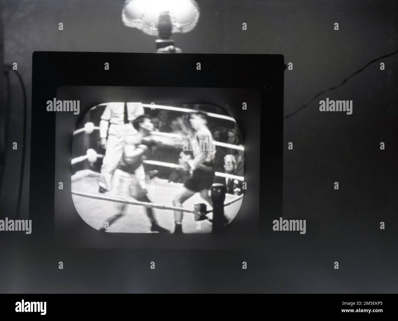 Late 1950s, historical, a television set of the era showing a boxing ...