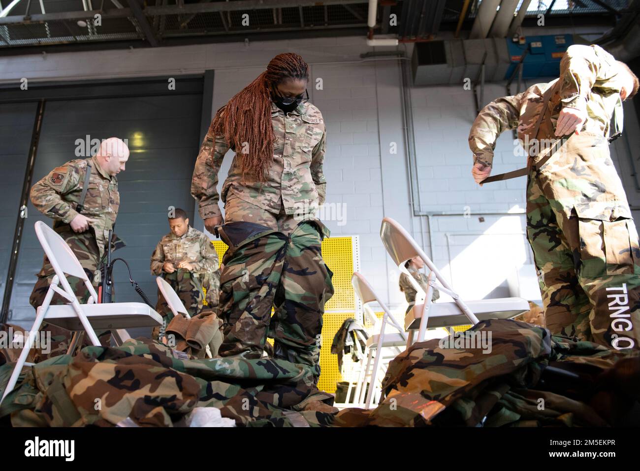 U.S. Air Force Airmen don their mission-oriented protective posture ...