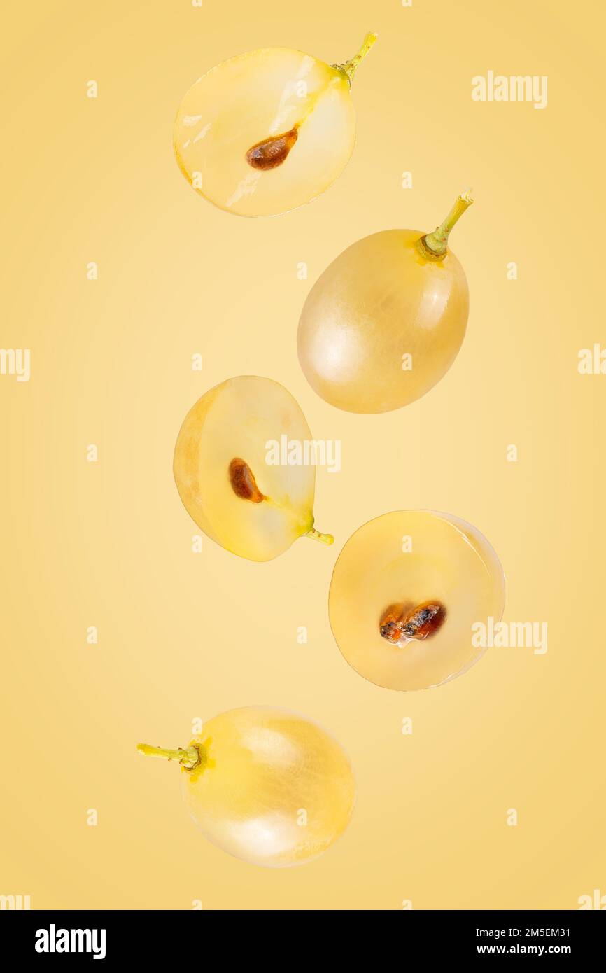 Falling white grapes isolated with clipping path Stock Photo - Alamy