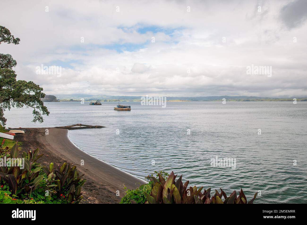 The beautiful Kawhia Harbor under a cloudy sky in summer Stock Photo ...