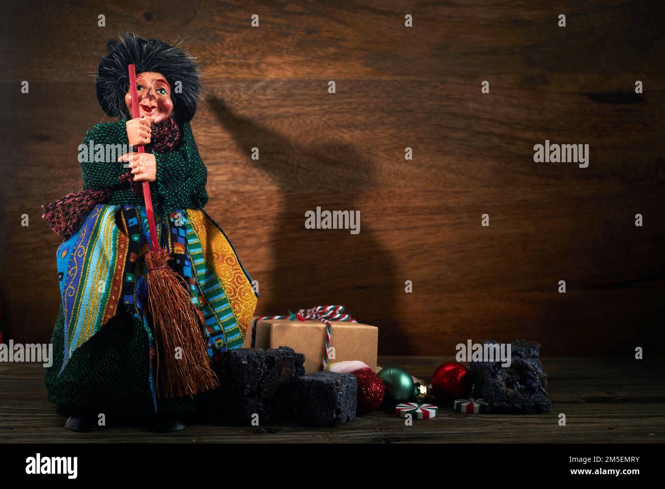 The Befana with sweet coal and candy. Italian Epiphany day tradition ...