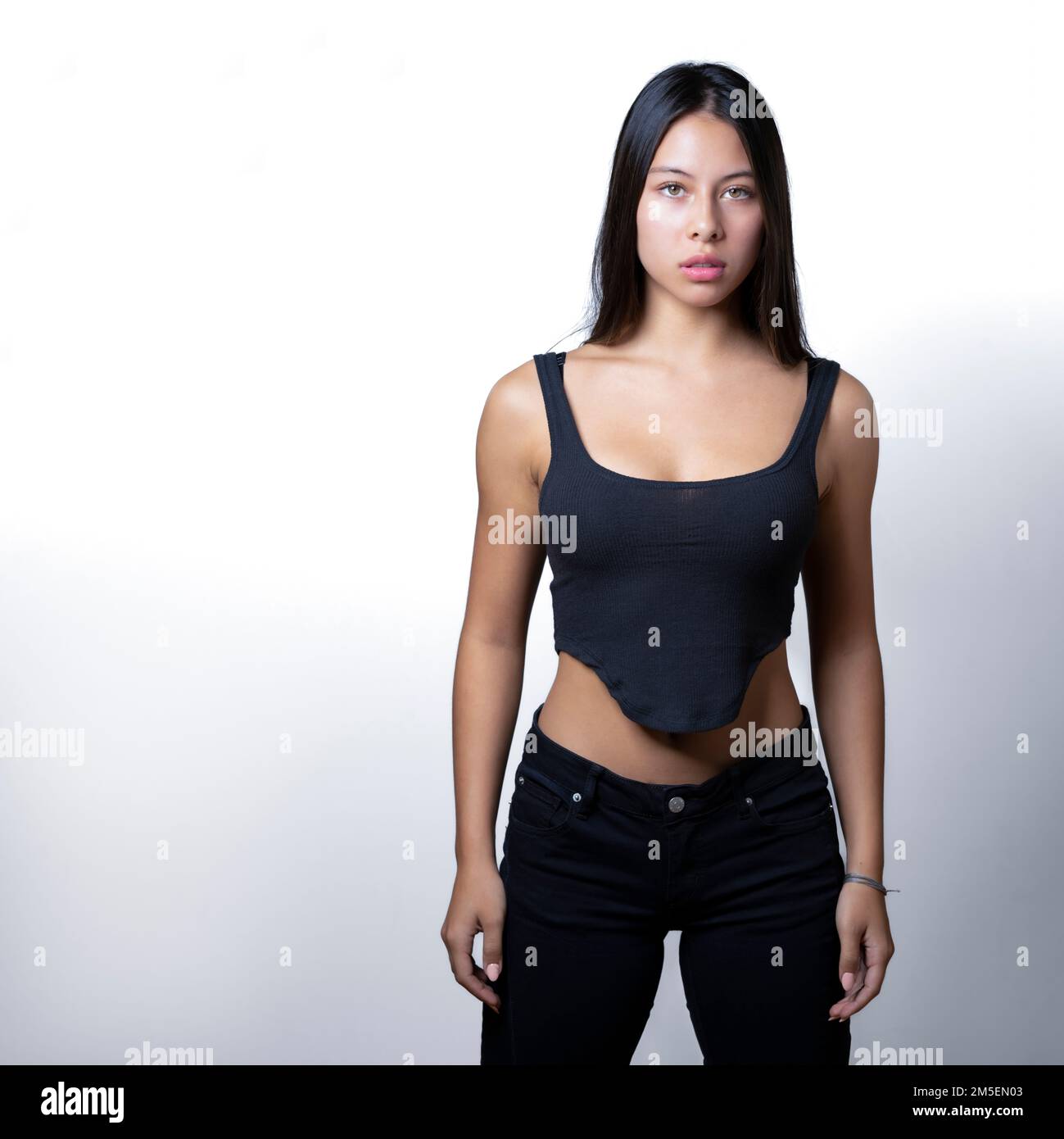 Edgy Multiracial Teen Female Standing in Front of White Background ...