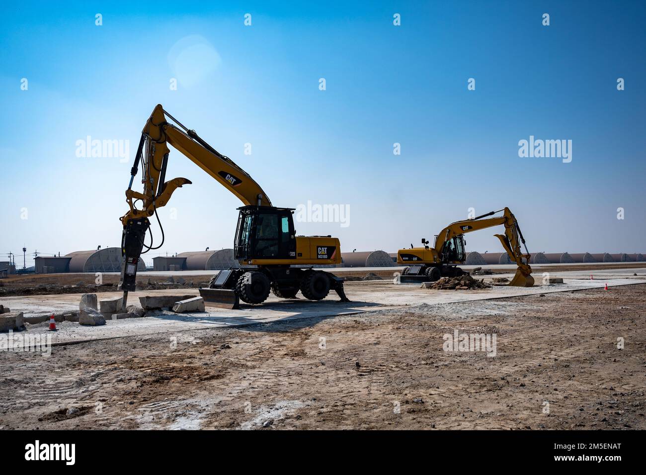 Airmen assigned to the 8th Civil Engineer Squadron operate excavators ...