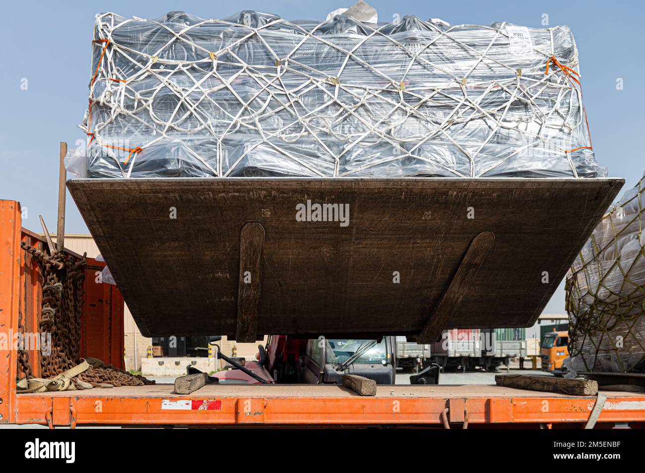 A forklift transports pallets from trailers to the Joint Military Mail ...
