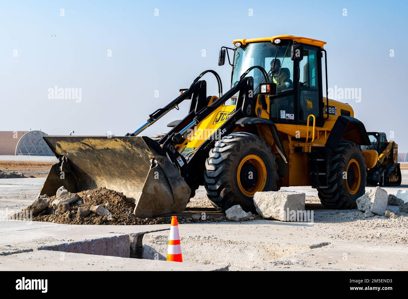An Airman assigned to the 8th Civil Engineer Squadron clears debris ...