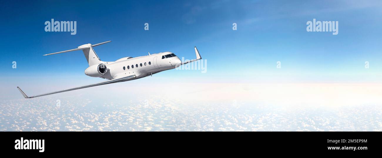 A business plane flying at flight level high in the sky above the ...