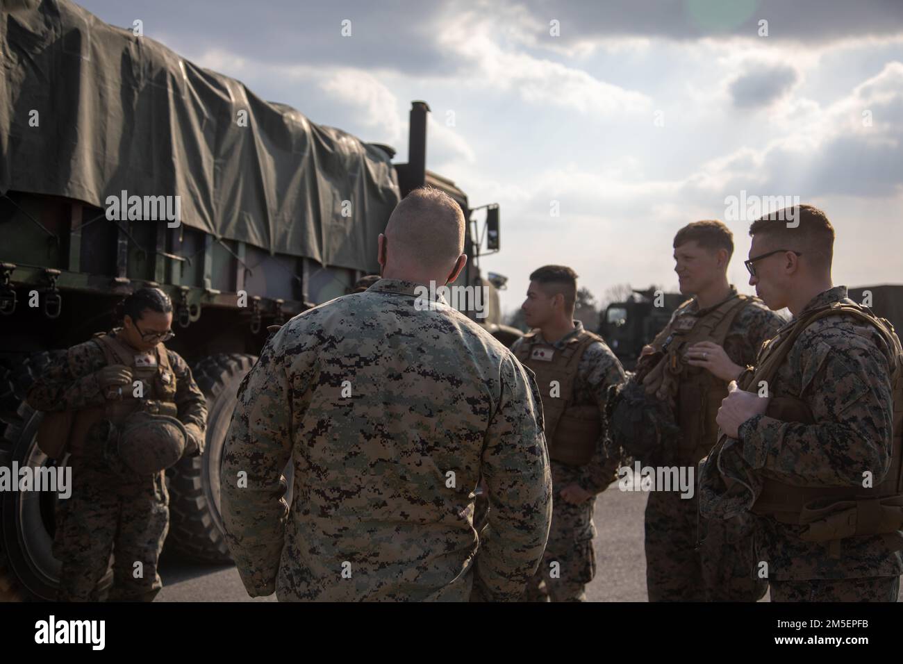U.S. Marine Corps Gunnery Sgt. Michael L. Benson (center), a combat ...